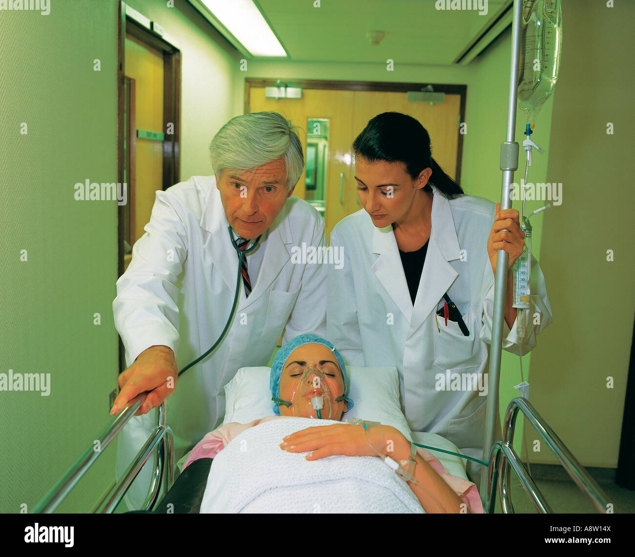 Hospital Accident and Emergency unit. Doctor and nurse pushing Stock ... Hospital Accident and Emergency unit. Doctor and nurse pushing Stock ...