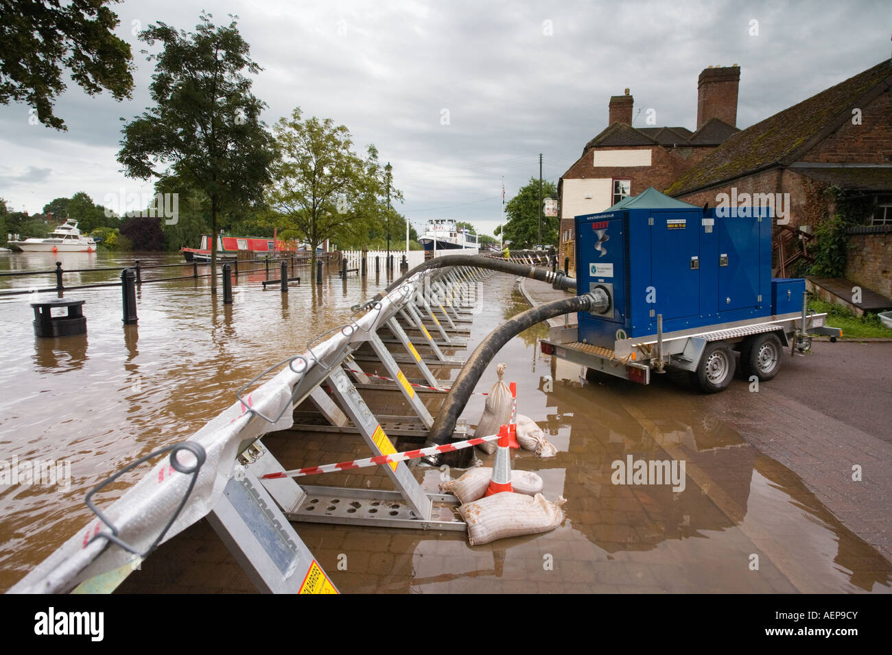 Emergency Flood Barriers And Water Pump Erected At Upton On Severn
