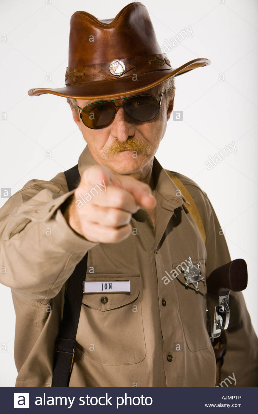 Close-up of a police officer pointing forward Stock Photo, Royalty Free ... Close-up of a police officer pointing forward Stock Photo, Royalty Free ...