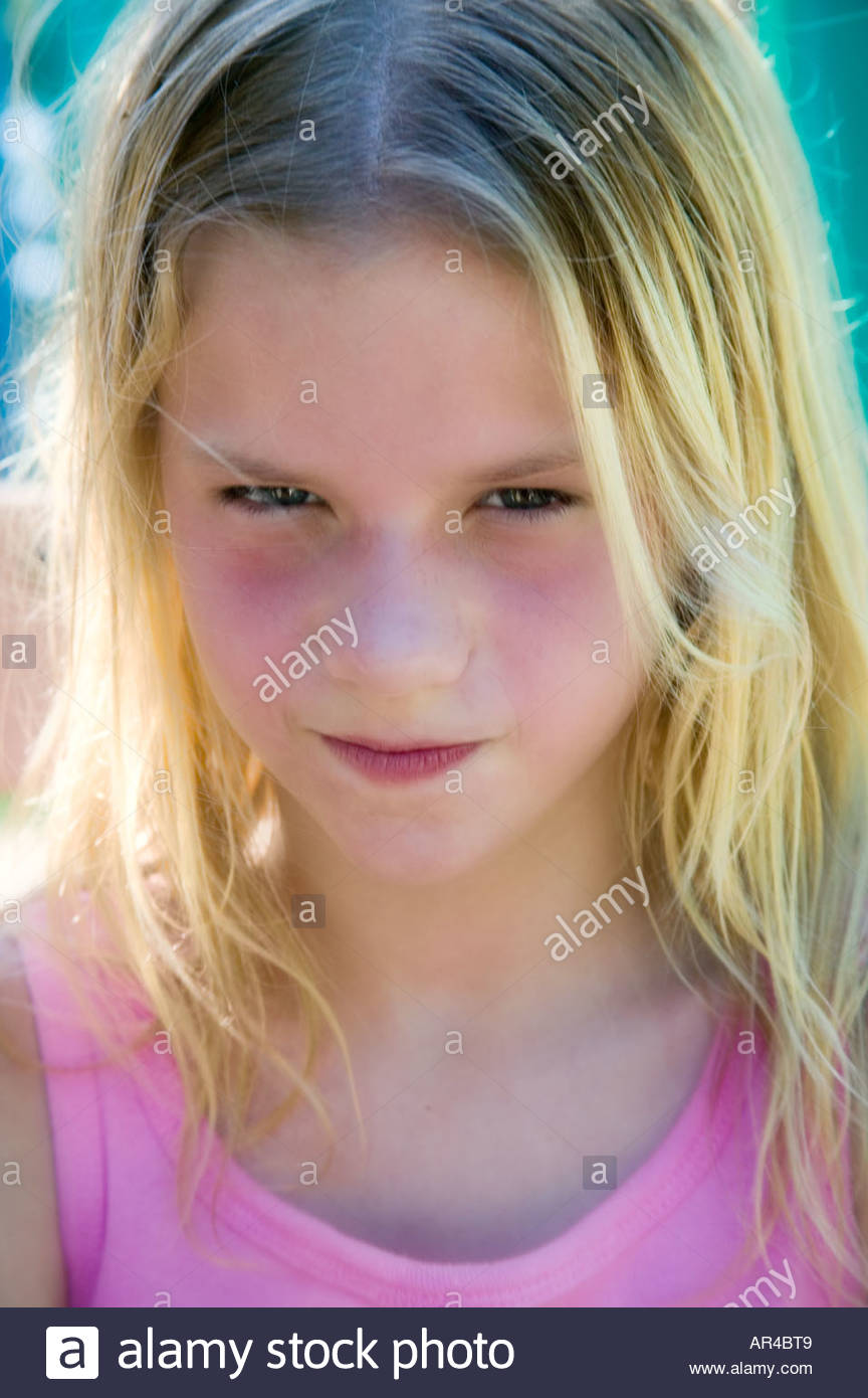 A Young Preteen Blond Girl Enjoys A Summers Afternoon In The Park Stock