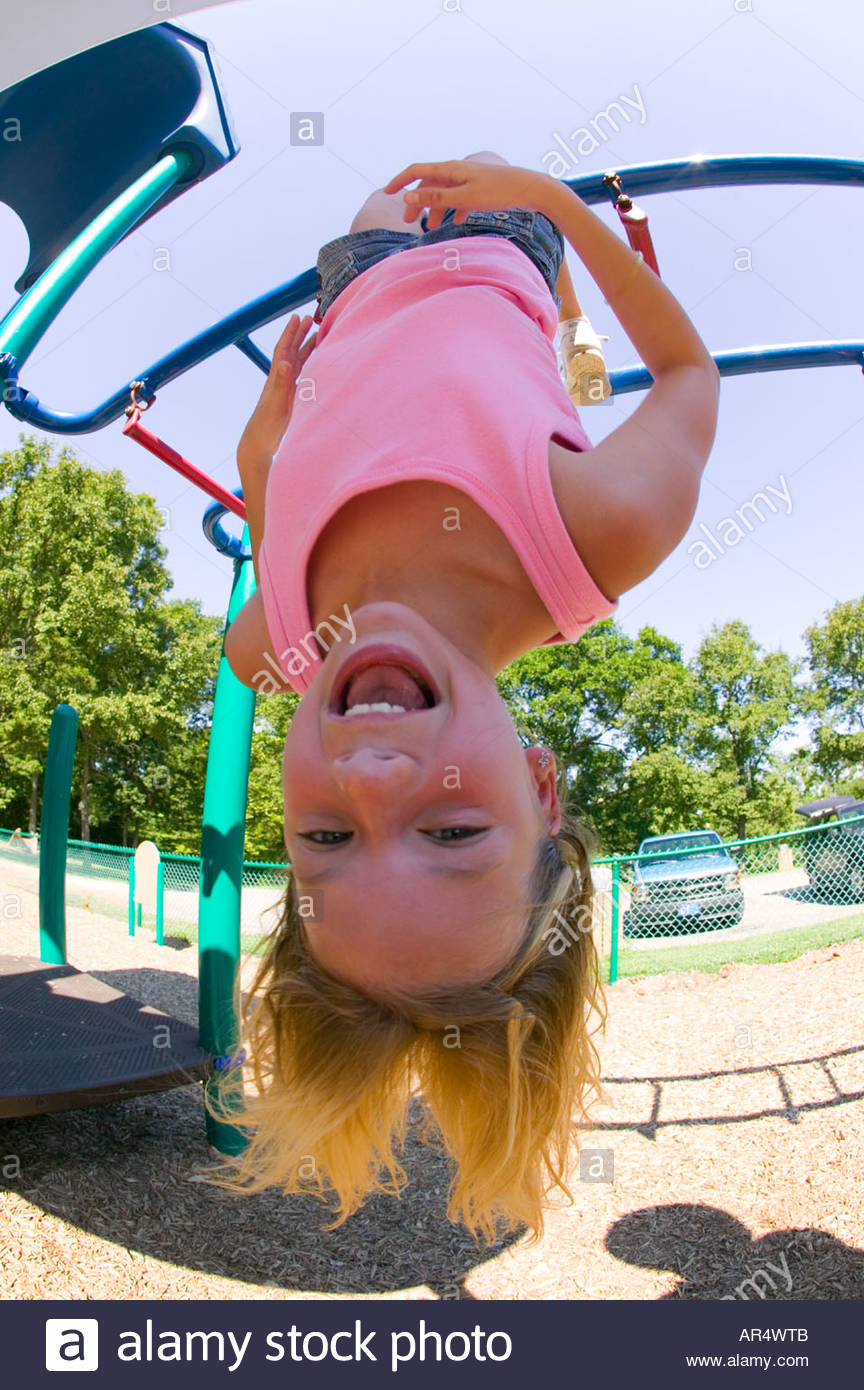 A Young Preteen Blond Girl Enjoys A Summers Afternoon In The Park Stock