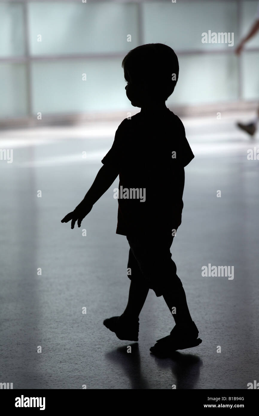 Silhouette Of A Little Boy Walking Alone Stock Photo, Royalty Free ... Silhouette Of A Little Boy Walking Alone Stock Photo, Royalty Free ...