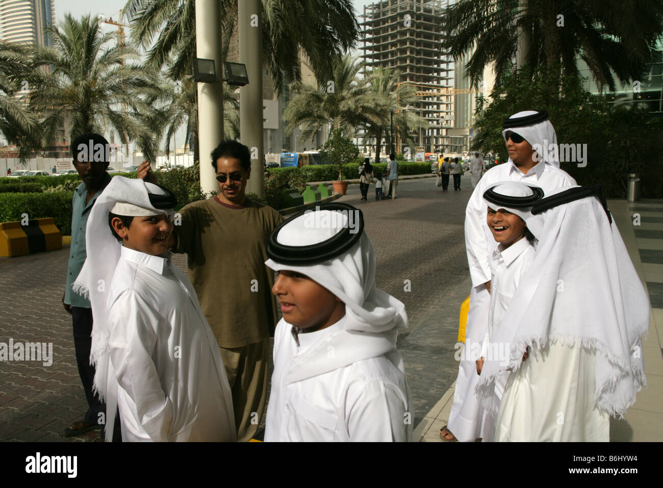 Qatari boys in traditional attire on the street of Doha, Qatar Stock ... Qatari boys in traditional attire on the street of Doha, Qatar Stock ...