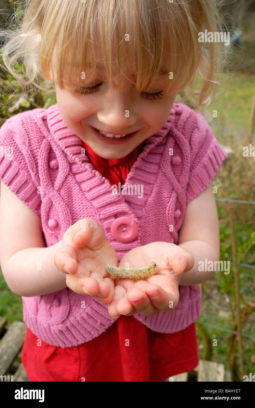 Young Girl With A Flower From A Willow Tree Pussy Willow Wales Stock