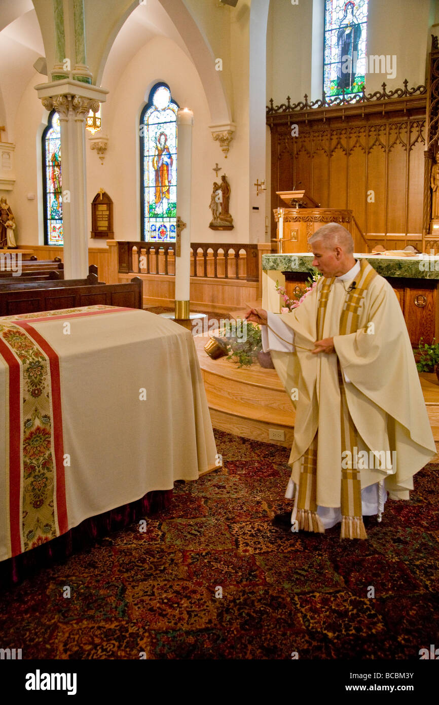 A Priest Waves A Sensor Over The Casket At A Catholic Funeral Mass In 