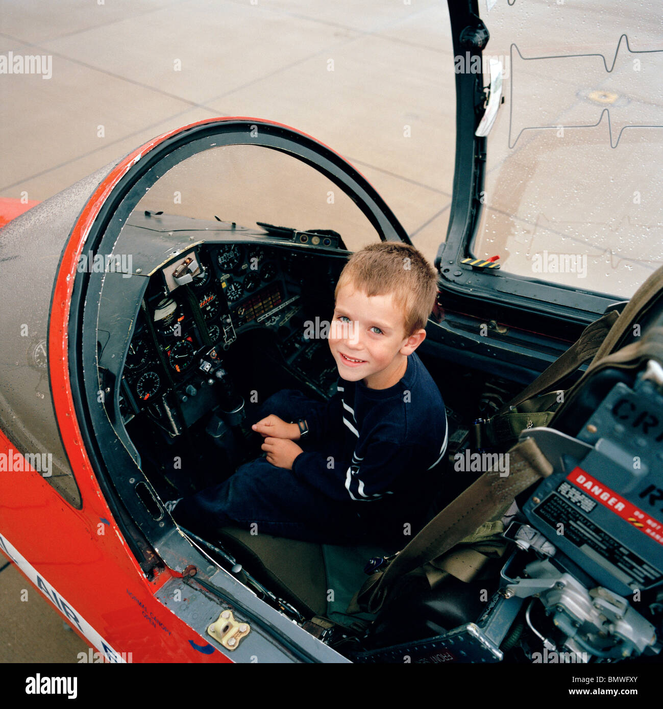 A young boy sits in BAE Systems Hawk cockpit of the 'Red Arrows' Stock Photo, Royalty Free Image ...