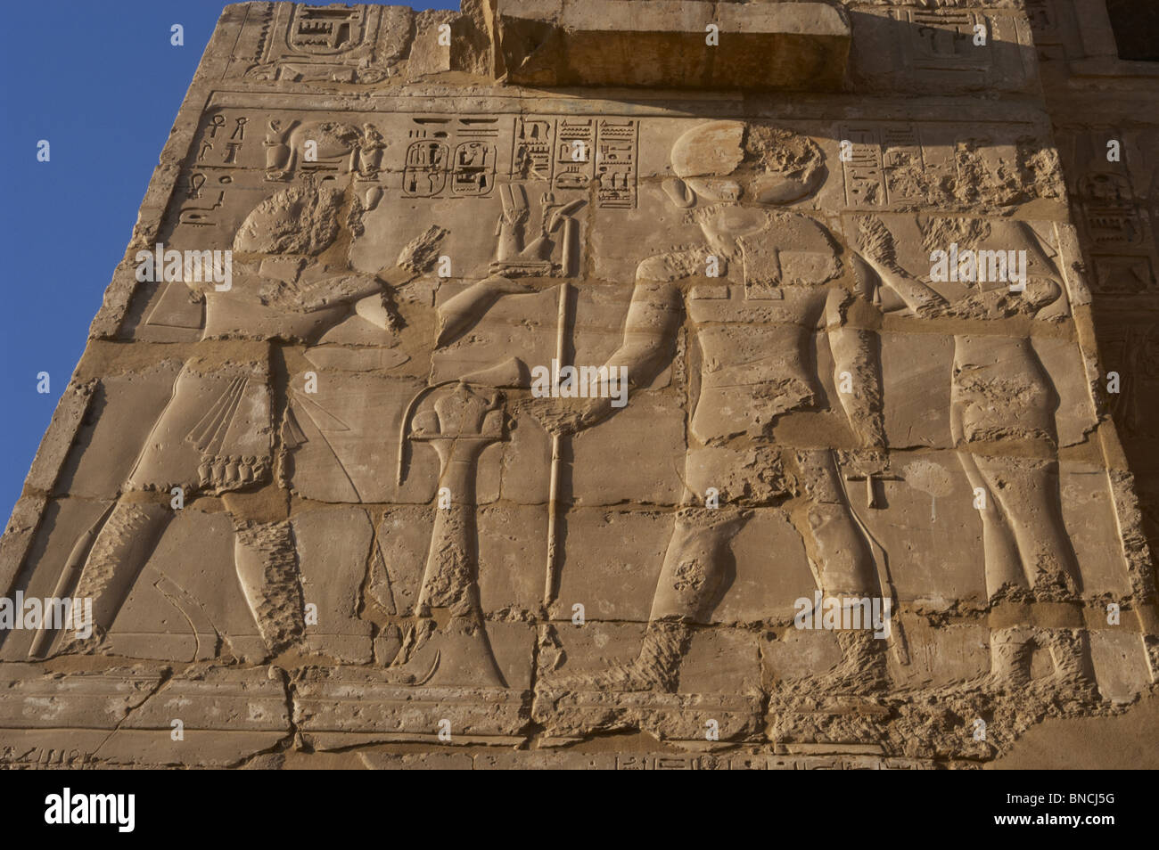 Temple of Ramses III. Relief depicting Ramses III making offerings Stock Photo, Royalty Free ...