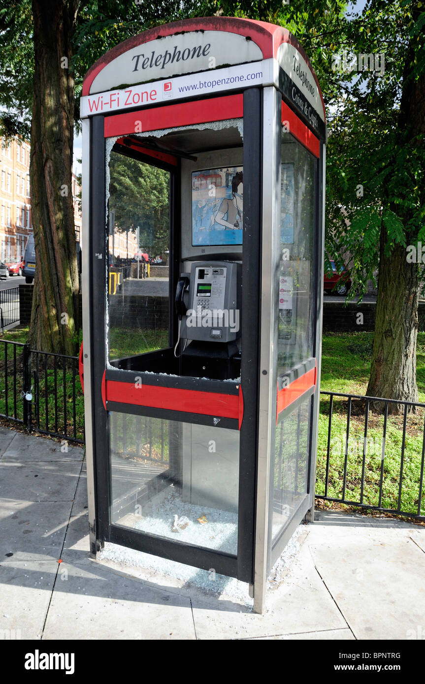 Vandalised public telephone box, Holloway Islington London England UK ... Vandalised public telephone box, Holloway Islington London England UK ...