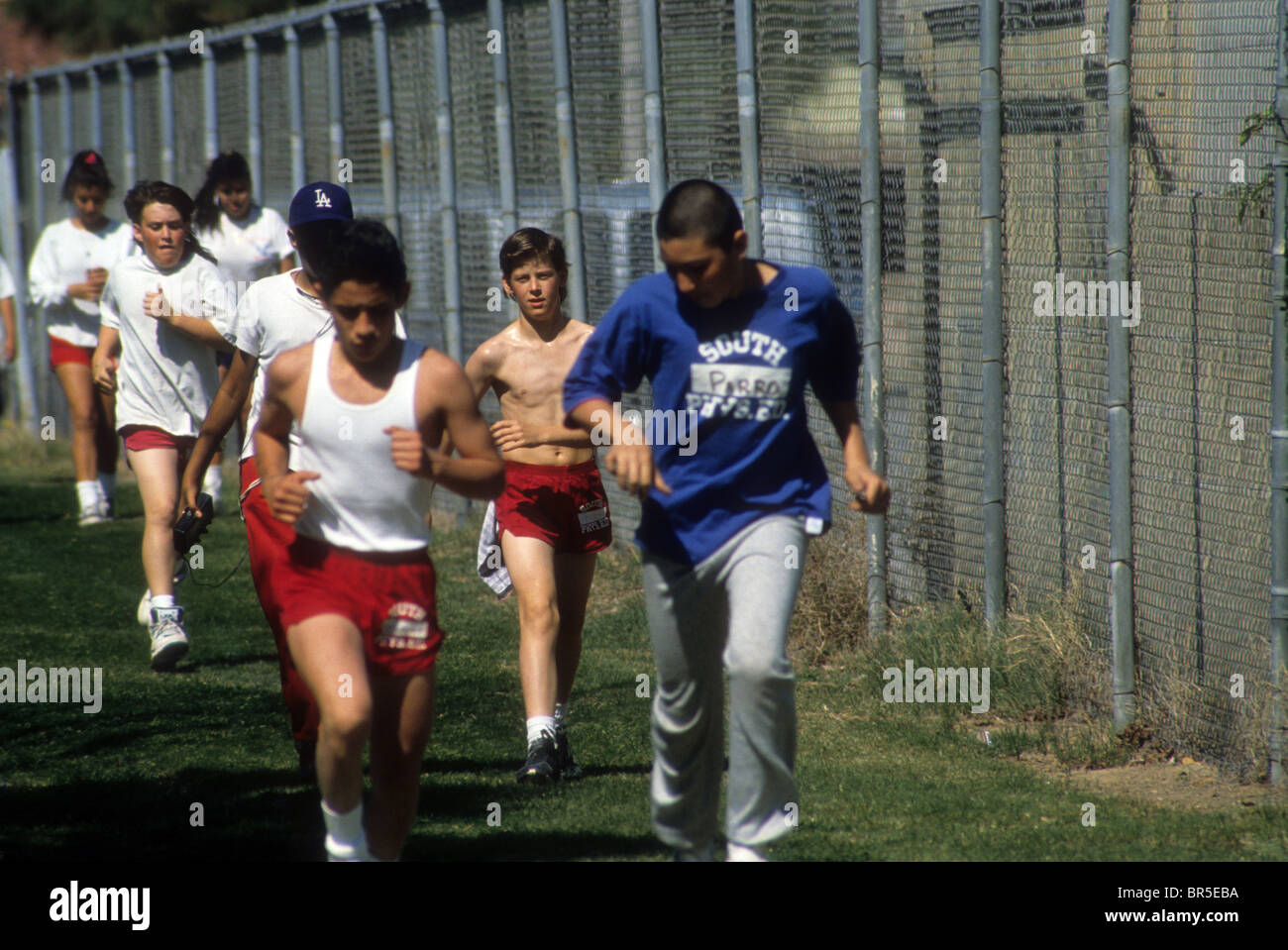 Junior High School Boy Run Race PE Physical Education Class Gym Stock junior-high-school-boy-run-race-pe-physical-education-class-gym-stock