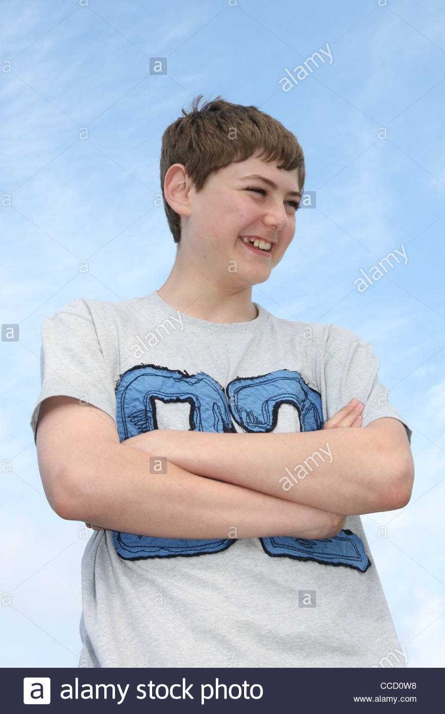 A teenage boy arms crossed and laughing Stock Photo, Royalty Free Image ... A teenage boy arms crossed and laughing Stock Photo, Royalty Free Image ...