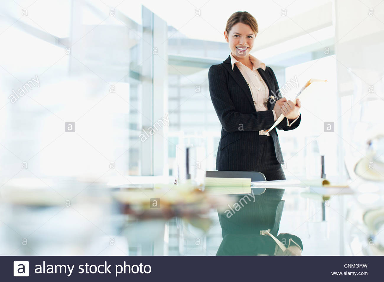 Businesswoman standing in conference room Stock Photo, Royalty Free ... Businesswoman standing in conference room Stock Photo, Royalty Free ...