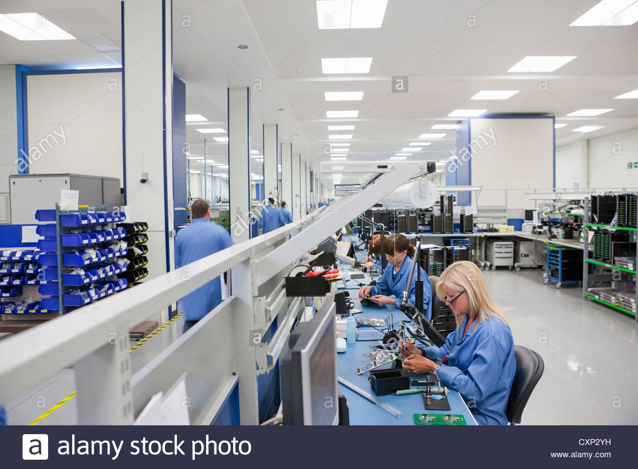Technicians working on assembly line in hi-tech electronics Stock Photo ... Technicians working on assembly line in hi-tech electronics Stock Photo ...