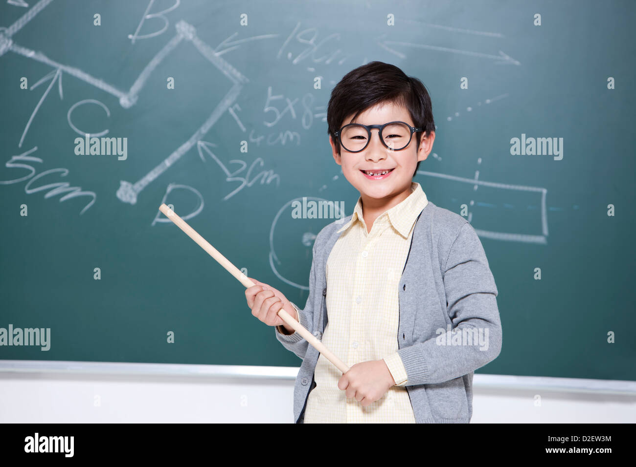Active little boy playing teacher in classroom Stock Photo: 53187448 ...
