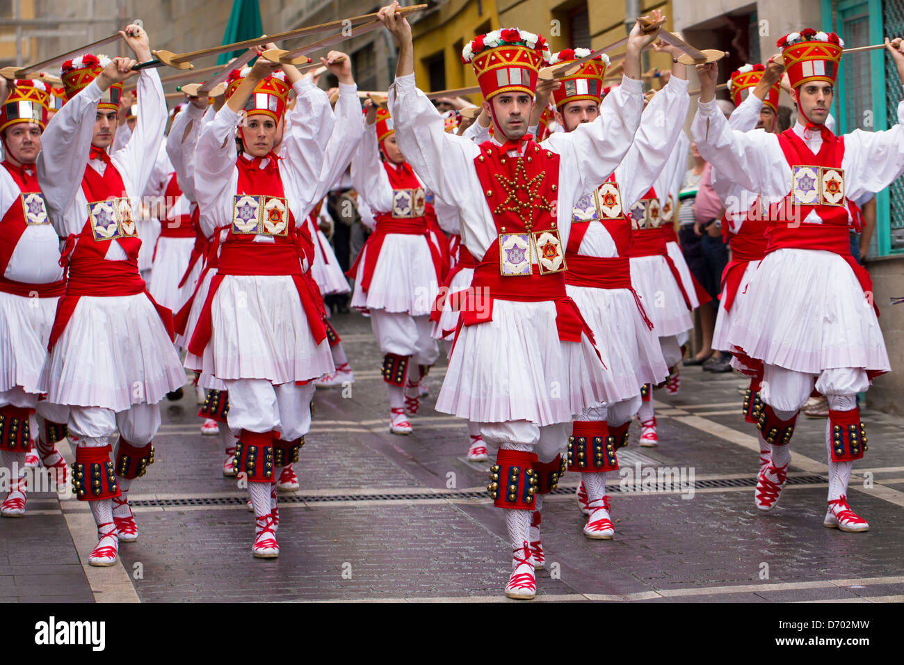 Dancers parading in procession through the streets during San Fermin ...