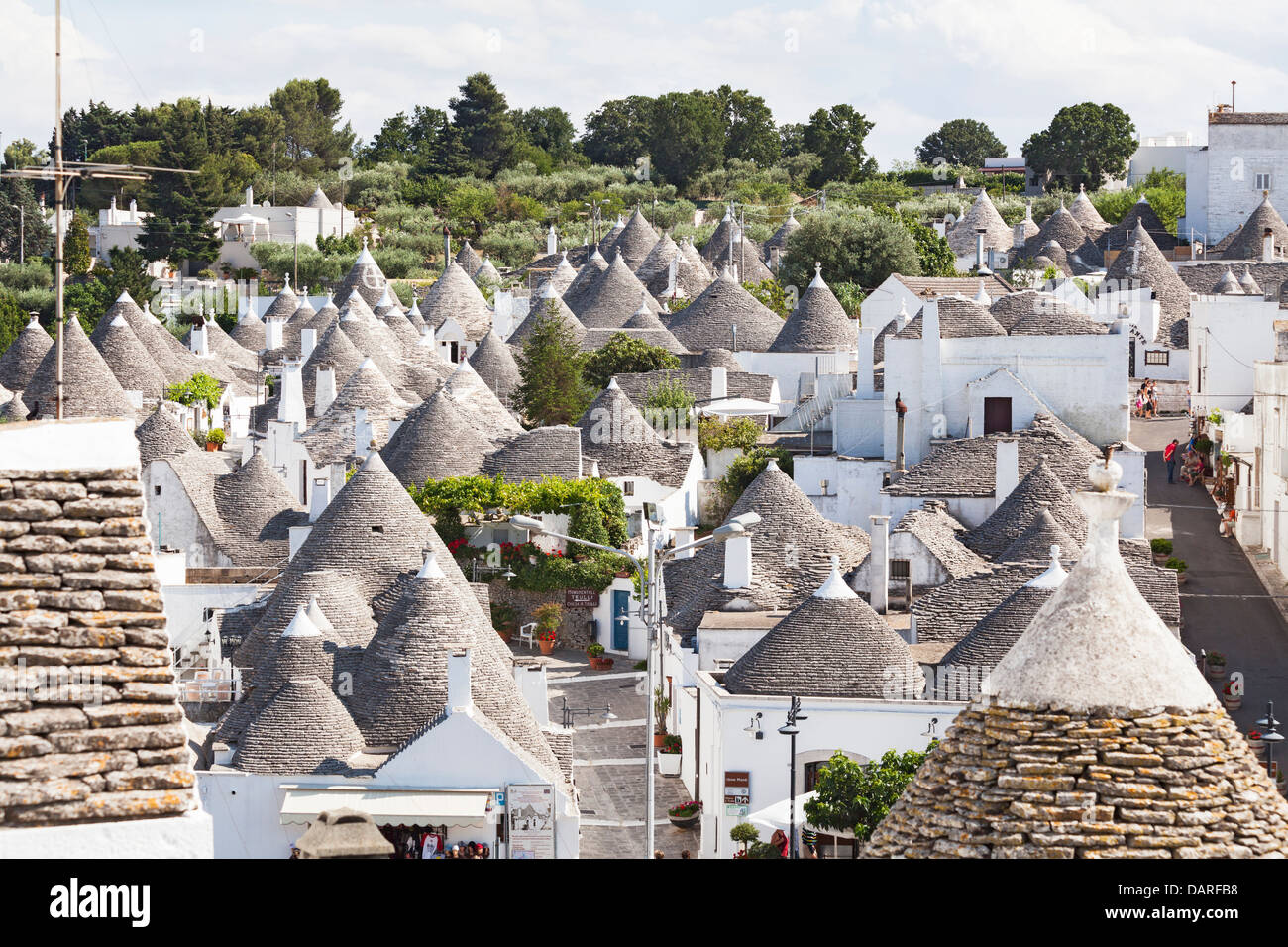 Conical stone roofs of whitewashed trulli houses in historic centre ... Conical stone roofs of whitewashed trulli houses in historic centre ...