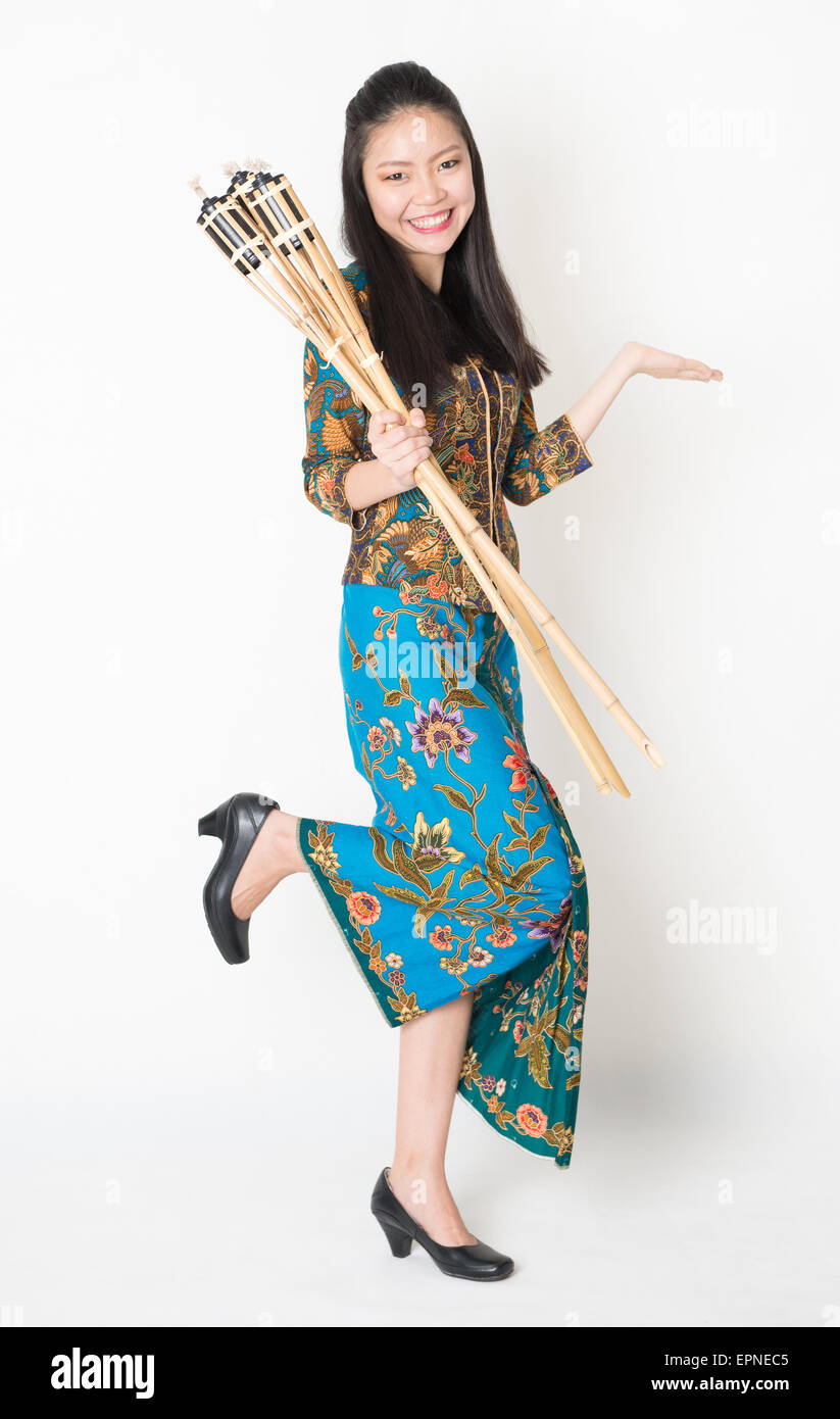 Full Body Portrait Of Southeast Asian Woman In Batik Dress Hand Stock