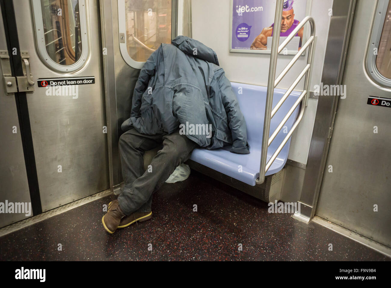 A Homeless Individual In The Subway In New York On Saturday December