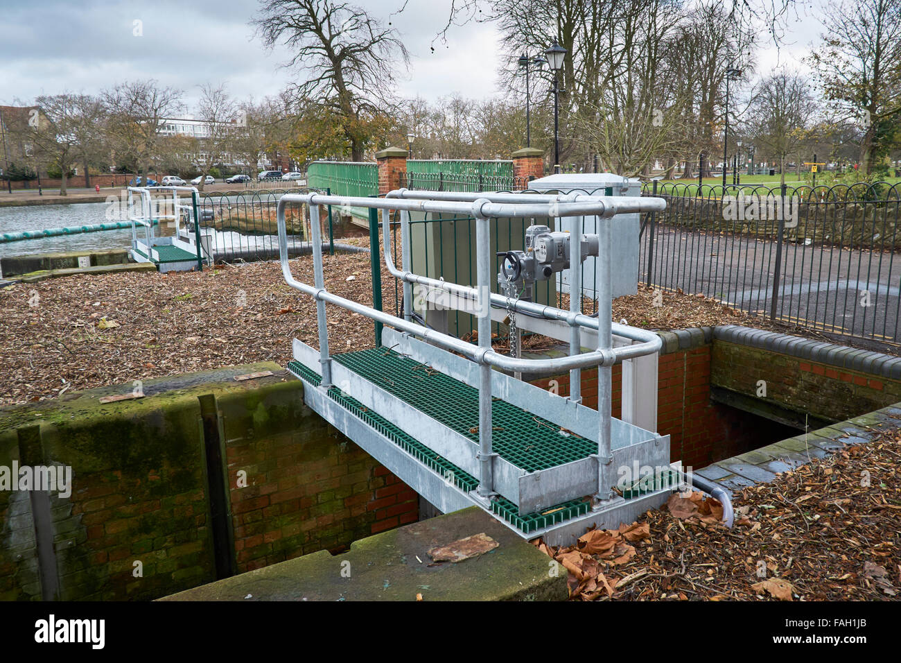 Automated electronic sluice gate retrofitted to original river weir ... Automated electronic sluice gate retrofitted to original river weir ...