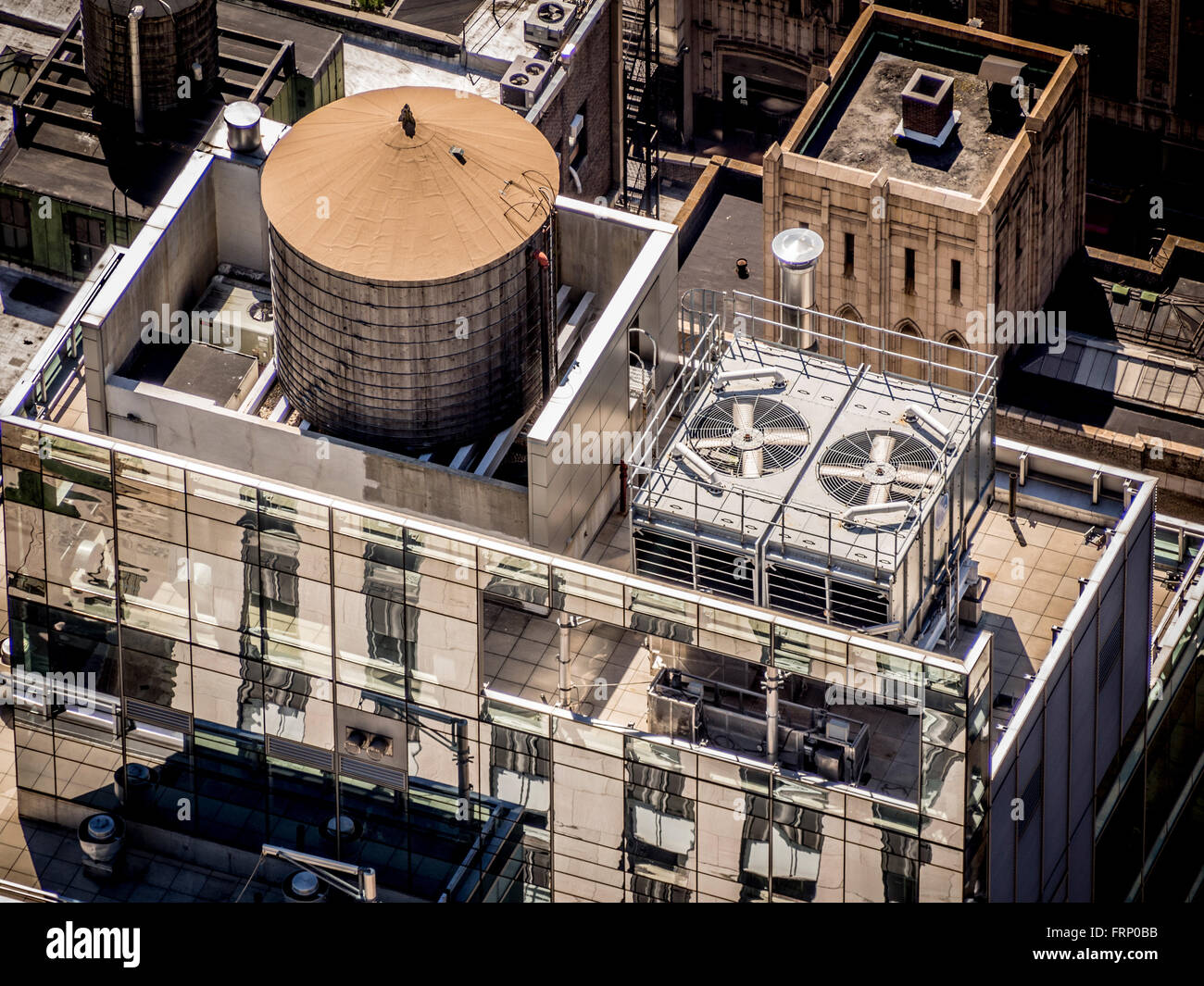 Traditional wooden Water Tower and air conditioning units on roof of ... Traditional wooden Water Tower and air conditioning units on roof of ...