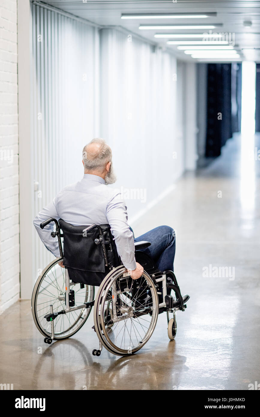 Back view of bearded senior man in wheelchair at hospital hallway Stock ... Back view of bearded senior man in wheelchair at hospital hallway Stock ...