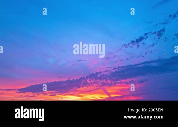 Dusk Sky timelapse. Moving clouds and sunset. Clouds float through the ...