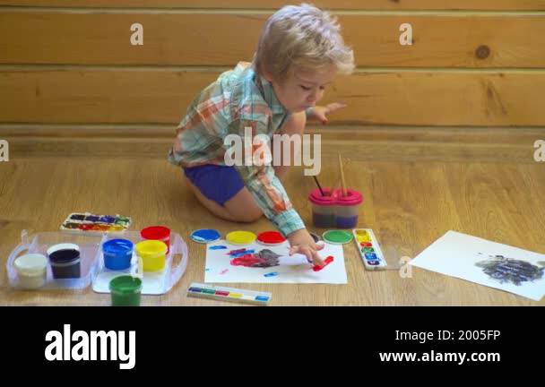 Preschool children. Cute little child painting and drawing. Kid with ...