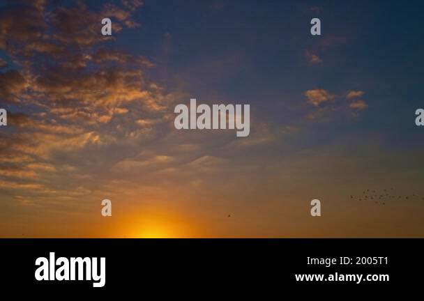 Dusk Sky timelapse. Moving clouds and sunset. Clouds float through the ...