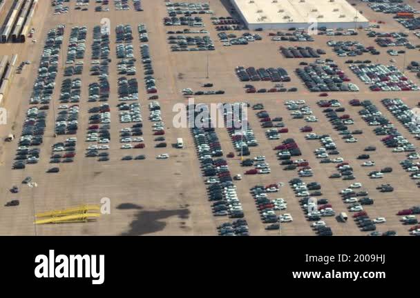 Car factory parking lot with brand new cars ready for export sale ...