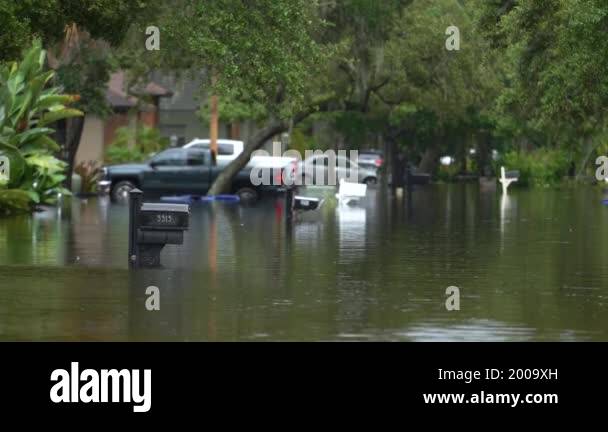 Hurricane Debby flooded street in Florida residential area. Aftermath ...