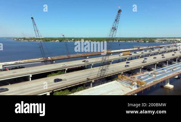 Driving traffic cars on freeway bridge road under construction ...
