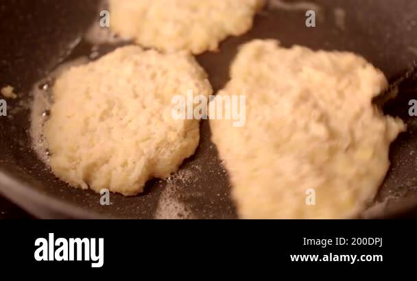 Delicious biscuits frying in a skillet, vividly showcasing the cooking ...