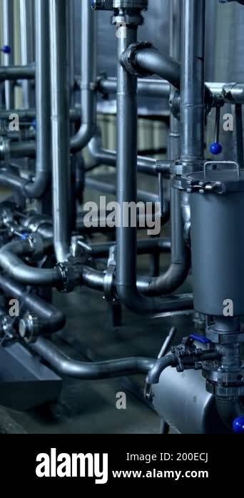 Modern industry for milk production. Stainless pipes inside the food ...