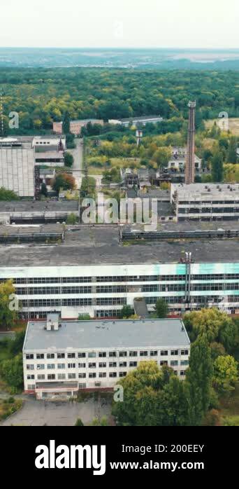 Large industrial territory on nature background. Many buildings of ...
