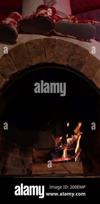 Burning fire in the fireplace. Low angle view of the fireplace with ...