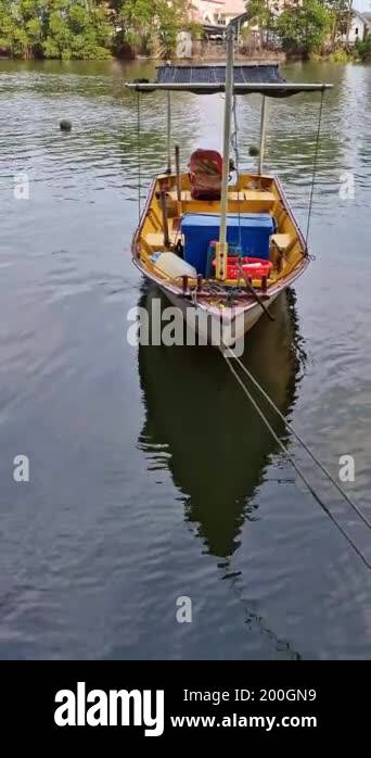 Vertical simple traditional boat made from wooden and fiberglass ...