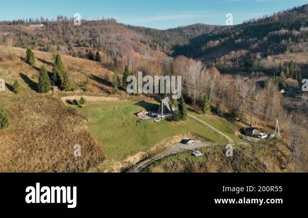 Hillside A-Frame Cabin with Scenic Views. Aerial view of an A-frame ...