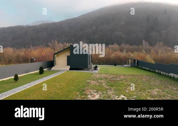 Modern Minimalist House in Rural Landscape. Contemporary black and wood ...