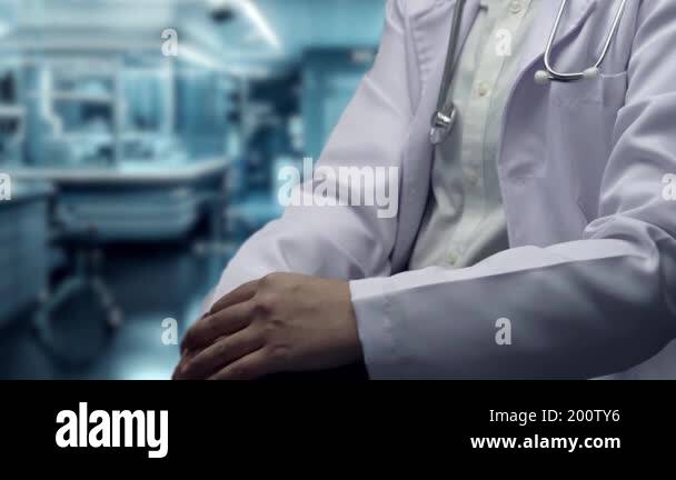 Close up of doctor sitting and showing medical cross hologram floating ...