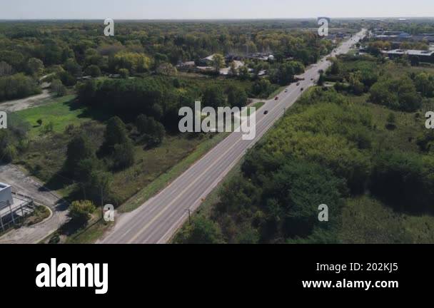 Residential houses and road in suburbs city. Wide aerial view. . High ...