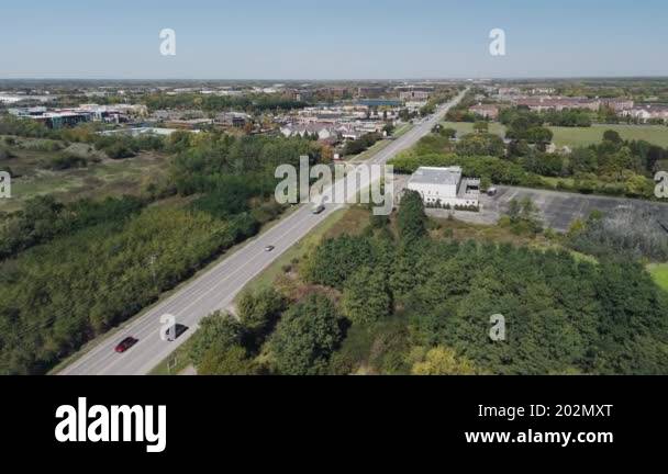 Residential houses and road in suburbs city. Wide drone view. . High ...