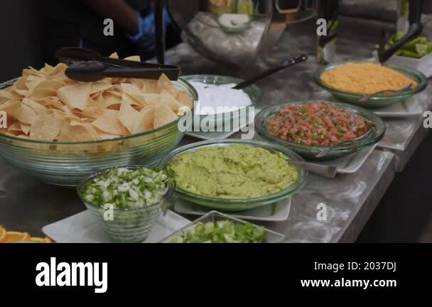 Enjoy a colorful display of crispy tortilla chips, tasty guacamole, and ...
