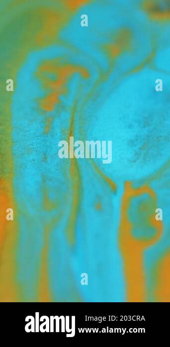 Vertical video. Ink splash. Shiny fluid blend. Blur orange golden blue ...