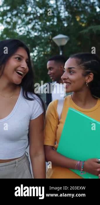 Vertical HD video of young group of American female student friends ...