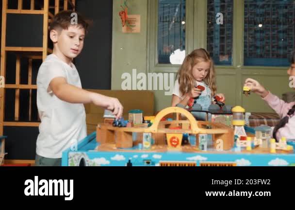 Multicultural girl playing toy to improve and develop creativity ...