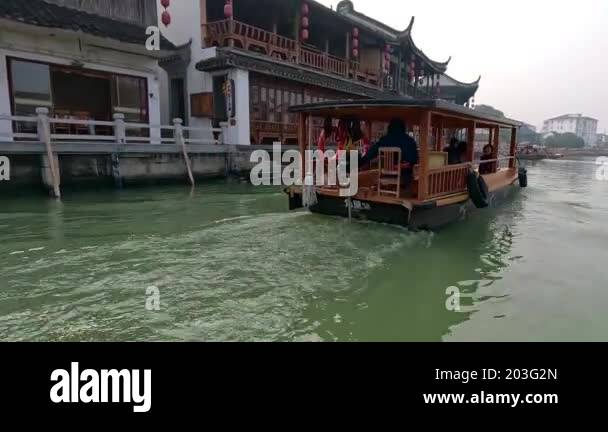 Shanghai, China - December 7, 2024 Wooden boat cruising at the Shanghai ...
