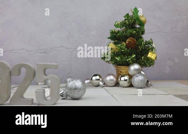 A Christmas Tree with golden and silver decorations, revealing number ...