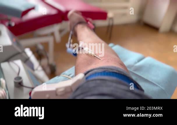 Extraction of blood from a vein using a needle Stock Video Footage - Alamy