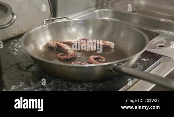 Octopus Tentacles on Frying Pan. Preparation Seafood by Chef Cook at ...