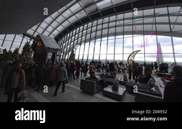 The Sky Garden in London features a modern interior with large windows ...