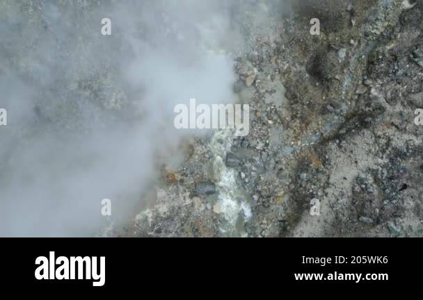 Top view of steaming fumaroles in the Kawah Ratu volcano crater in West ...